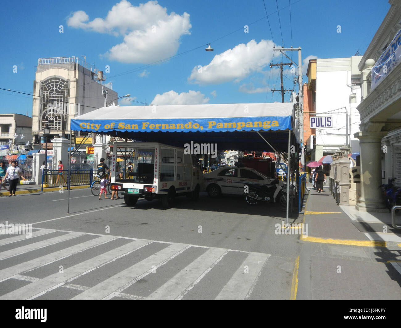 This image showcases a bustling urban scene in San Fernando City ...