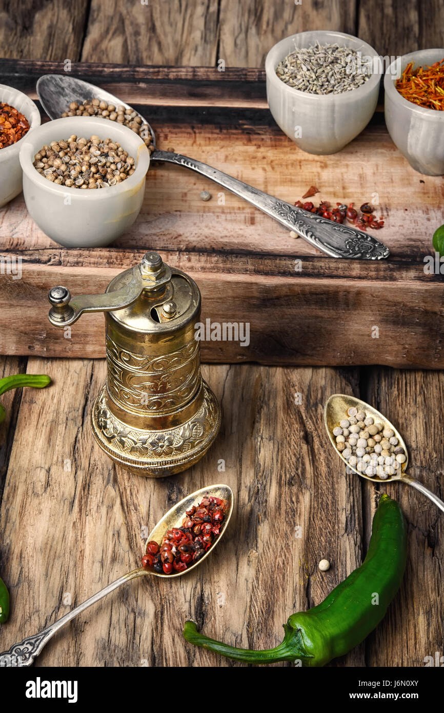 set of aromatic Indian spices and condiments on wooden retro background ...