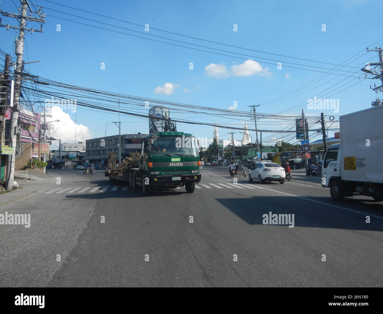 This image shows a scene of MacArthur Highway in Dolores, San Fernando ...