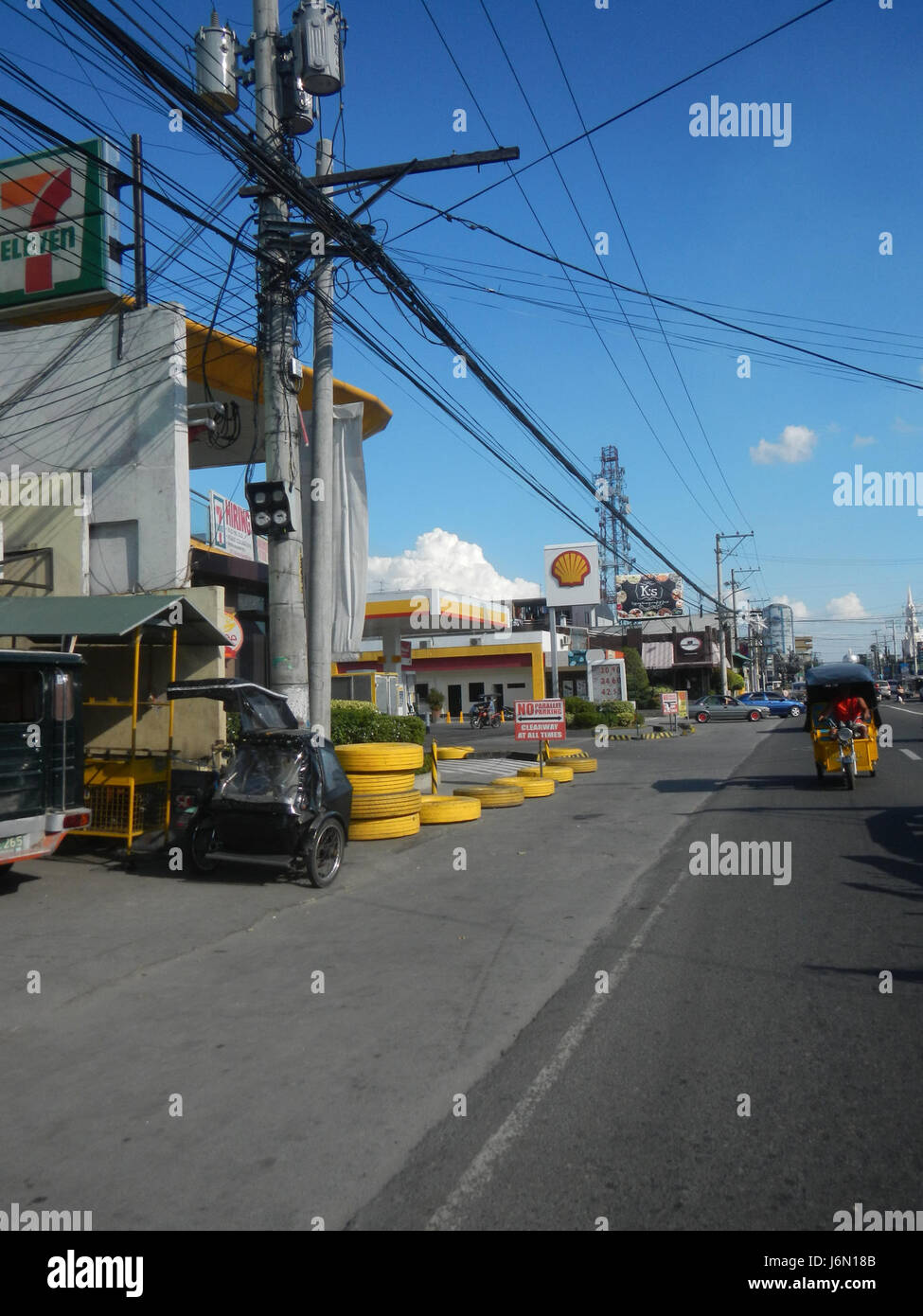 This image depicts the MacArthur Highway in San Fernando, Pampanga ...