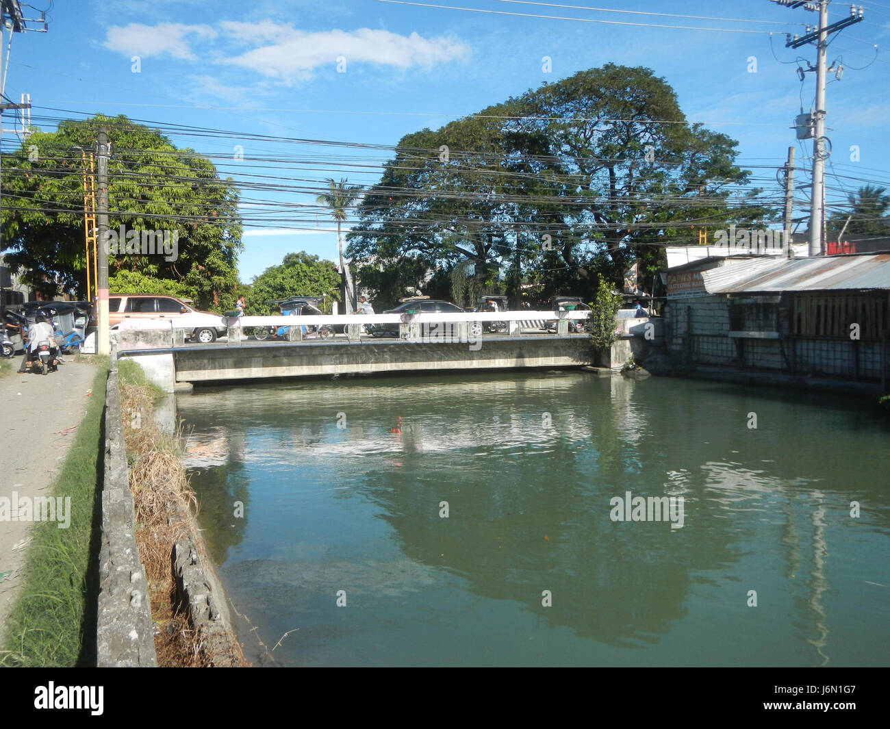 This image features the irrigation bridge across the creek in Bagong ...