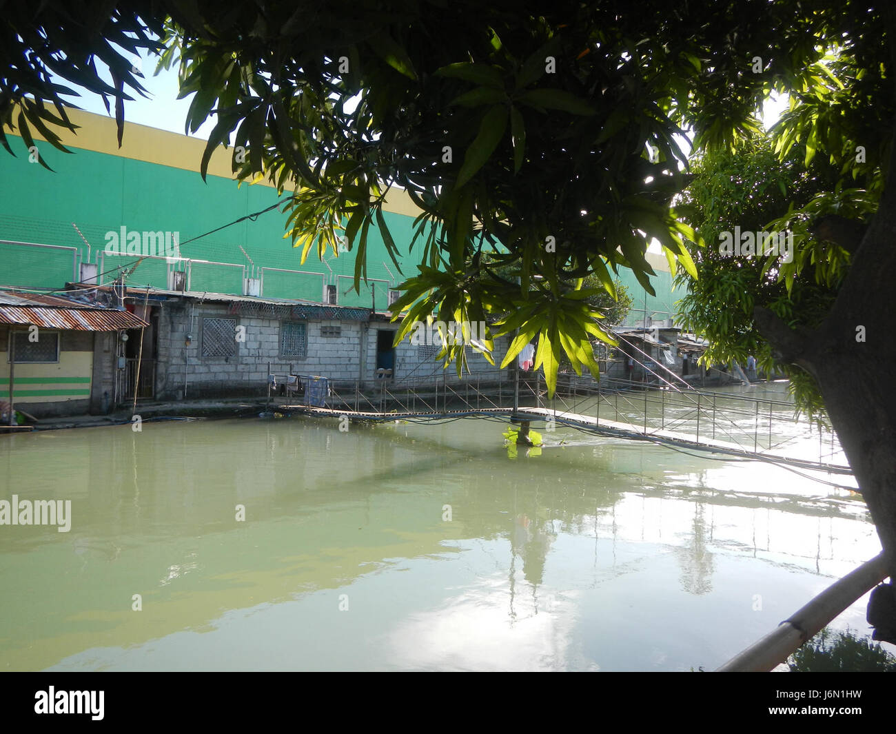 The image shows the irrigation bridge crossing a creek in Bagong Nayon ...