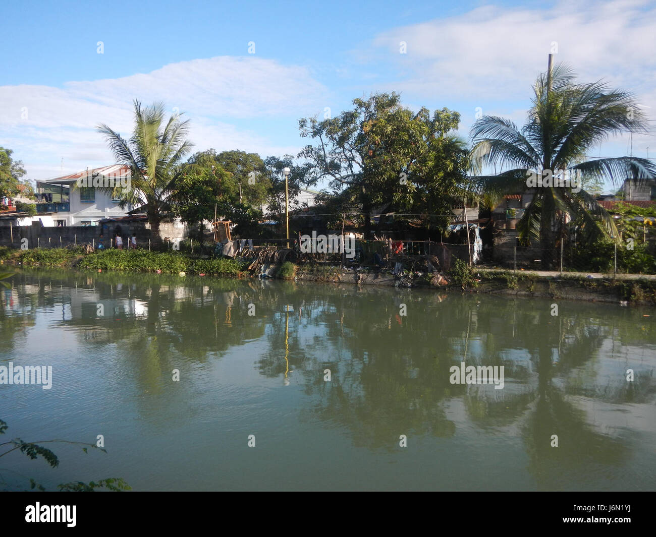 This photograph shows the paddy fields and irrigation system in Bagong ...