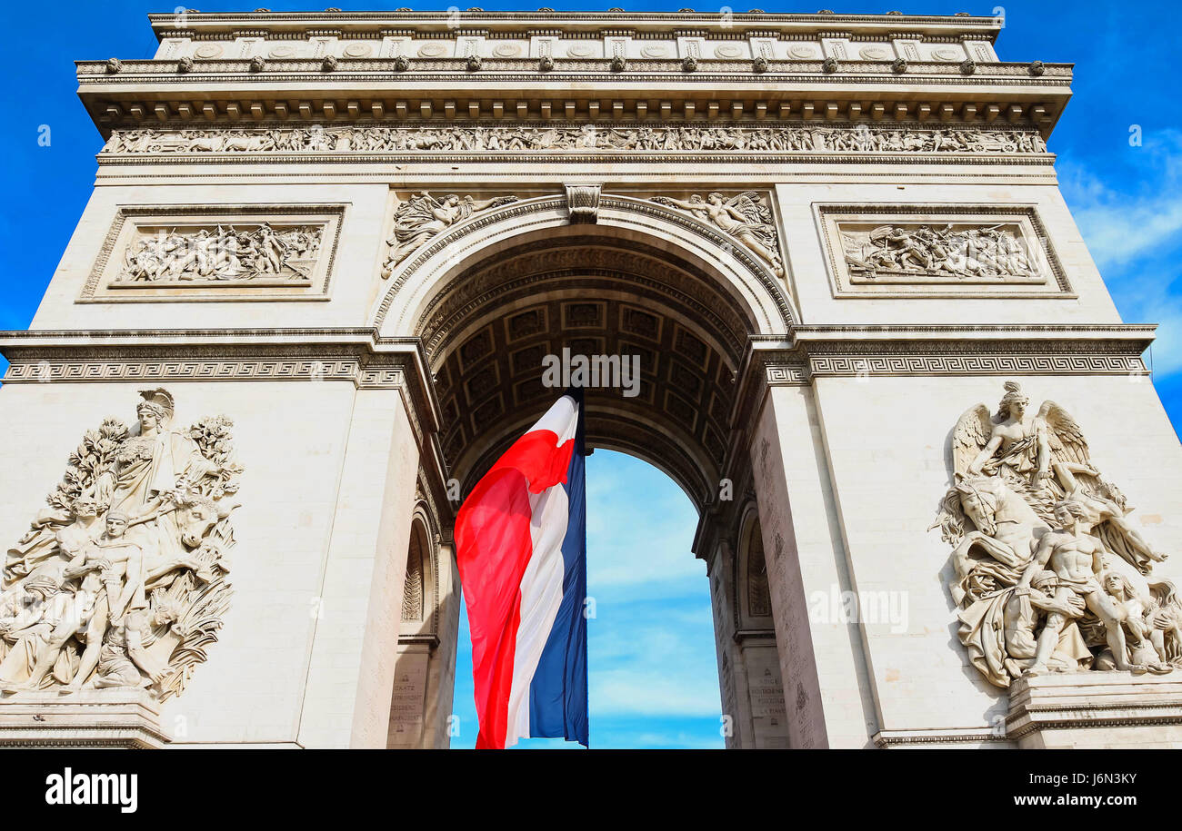 The Triumphal Arch decorated with French flag, Paris, France Stock ...