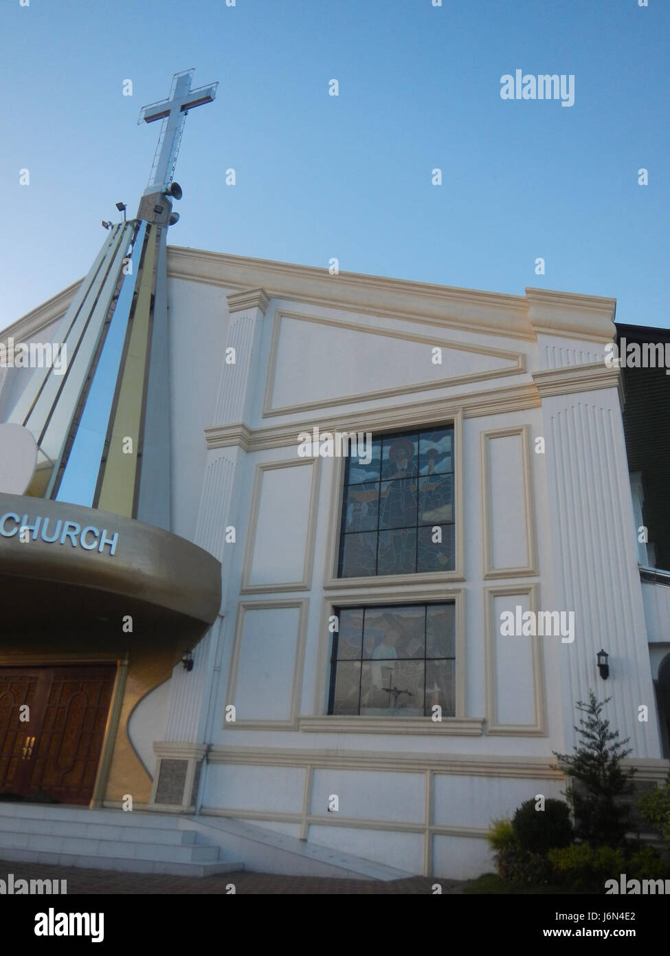 This image shows the exterior of the San Isidro Labrador Parish Church ...