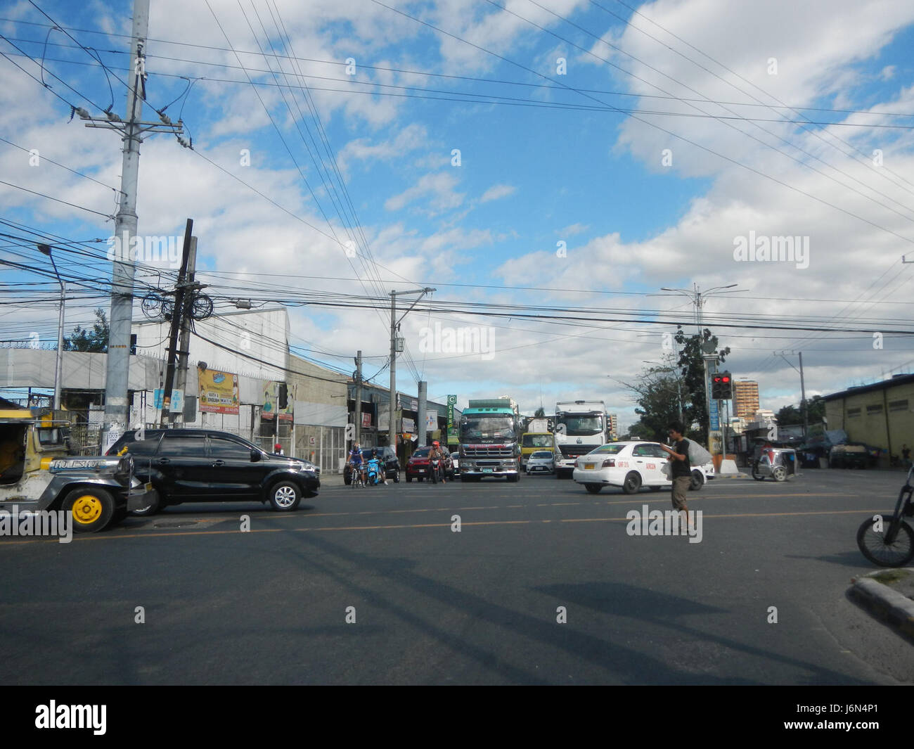This image captures a busy section of A. Mabini Street in the Maypajo ...