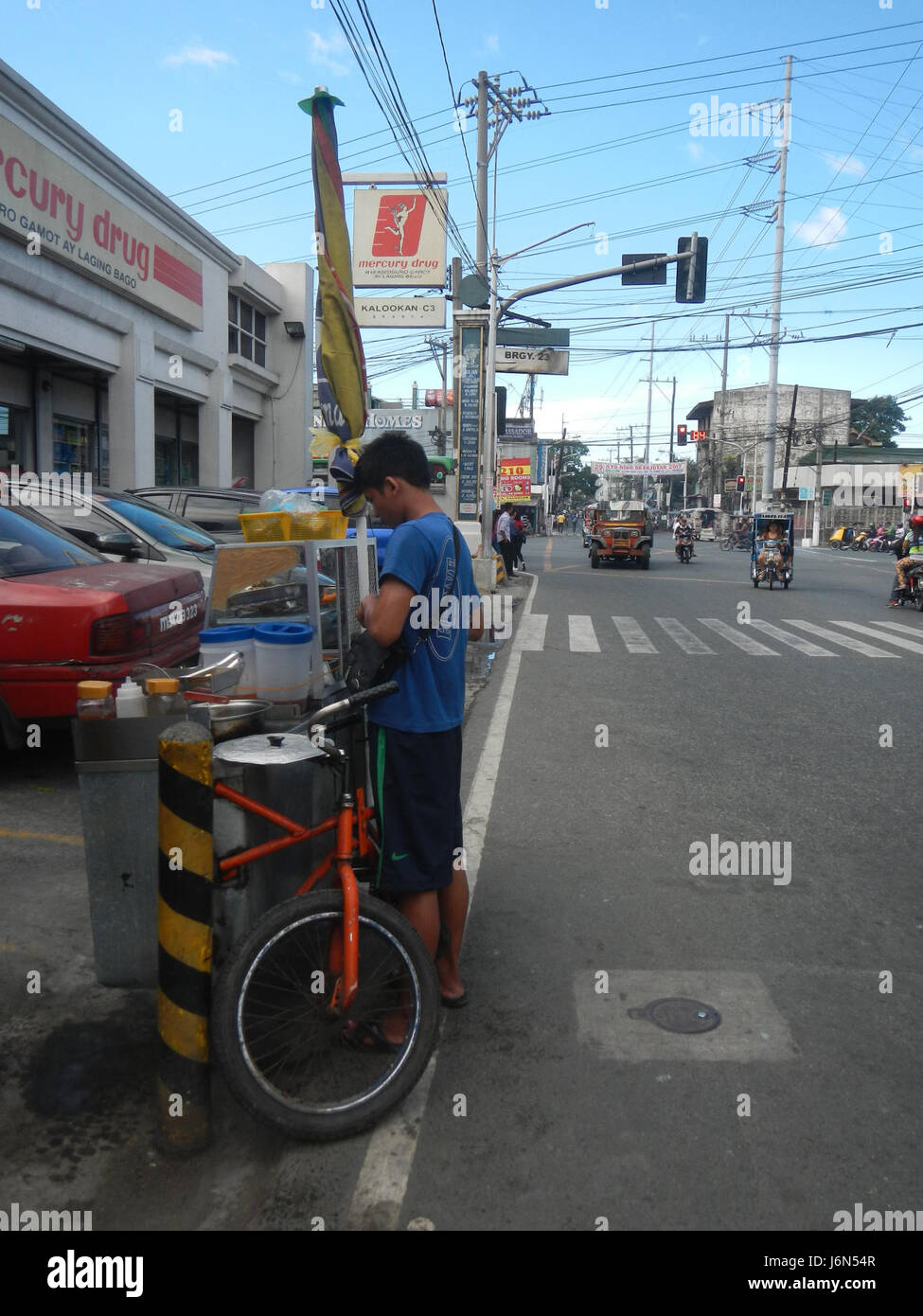 A view of A. Mabini Street in Caloocan City, Philippines, featuring ...