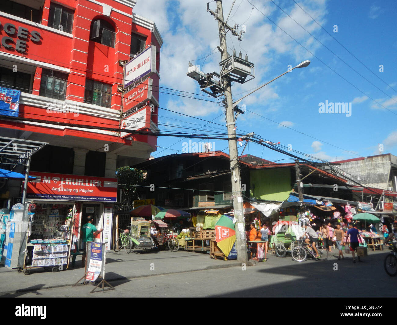 This image features the bustling market area along J. P. Rizal Mabini ...
