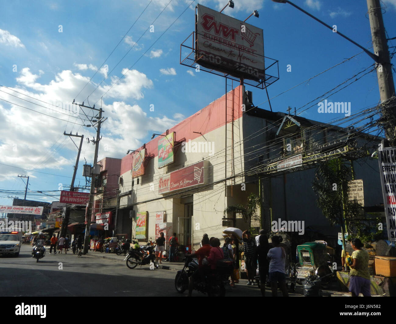 This photo depicts the busy Mabini Street market in the Maypajo ...