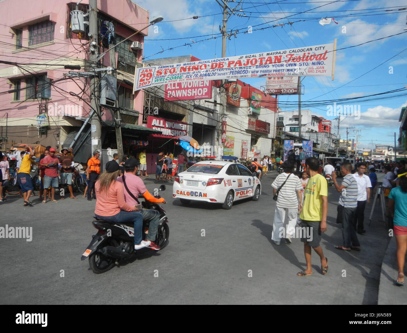 This image shows J.P. Rizal Mabini Street, located in Caloocan City. It ...