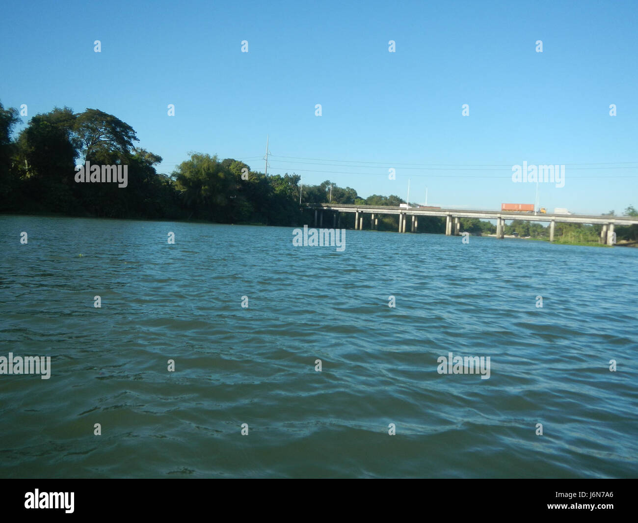 The image shows the ongoing riprap construction along the Pulilan ...