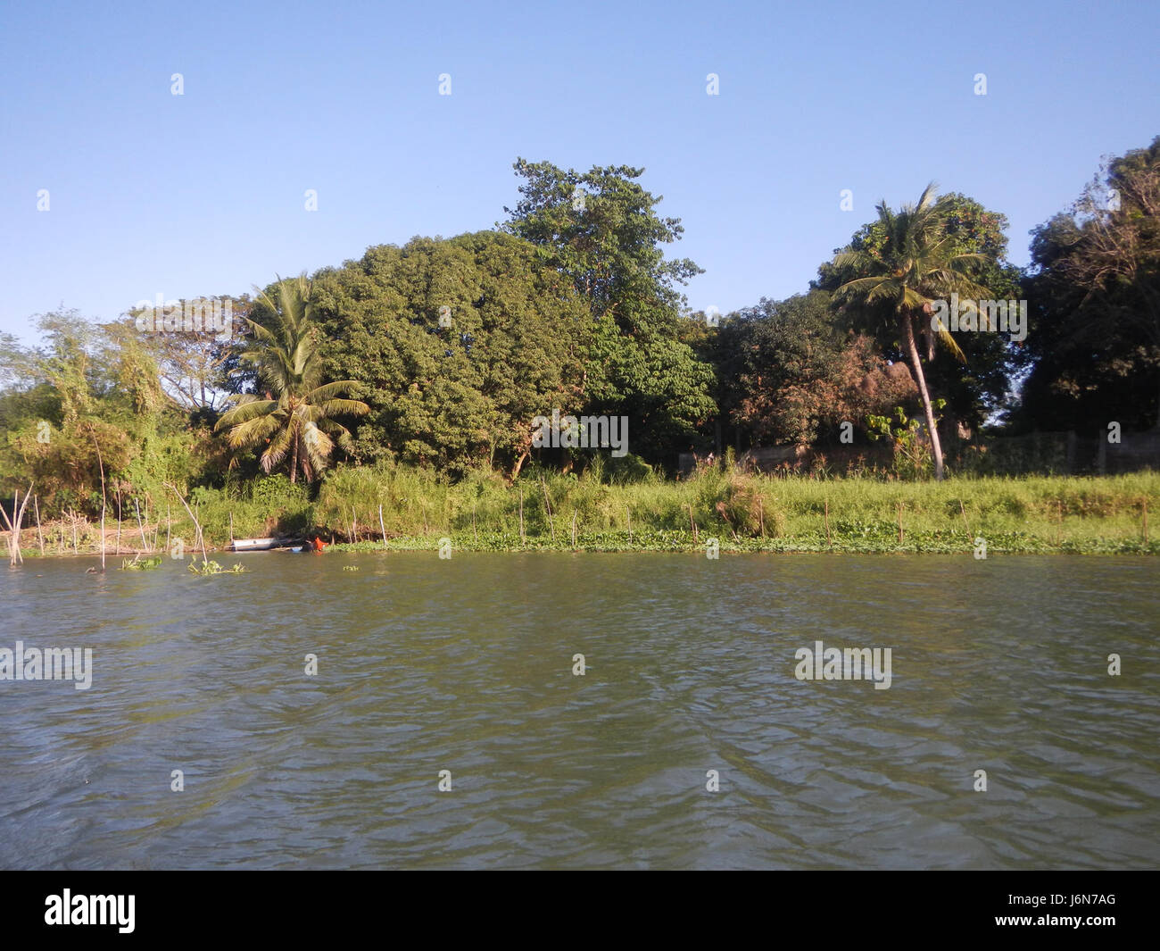 The image depicts the ongoing riprap construction along the Pulilan ...