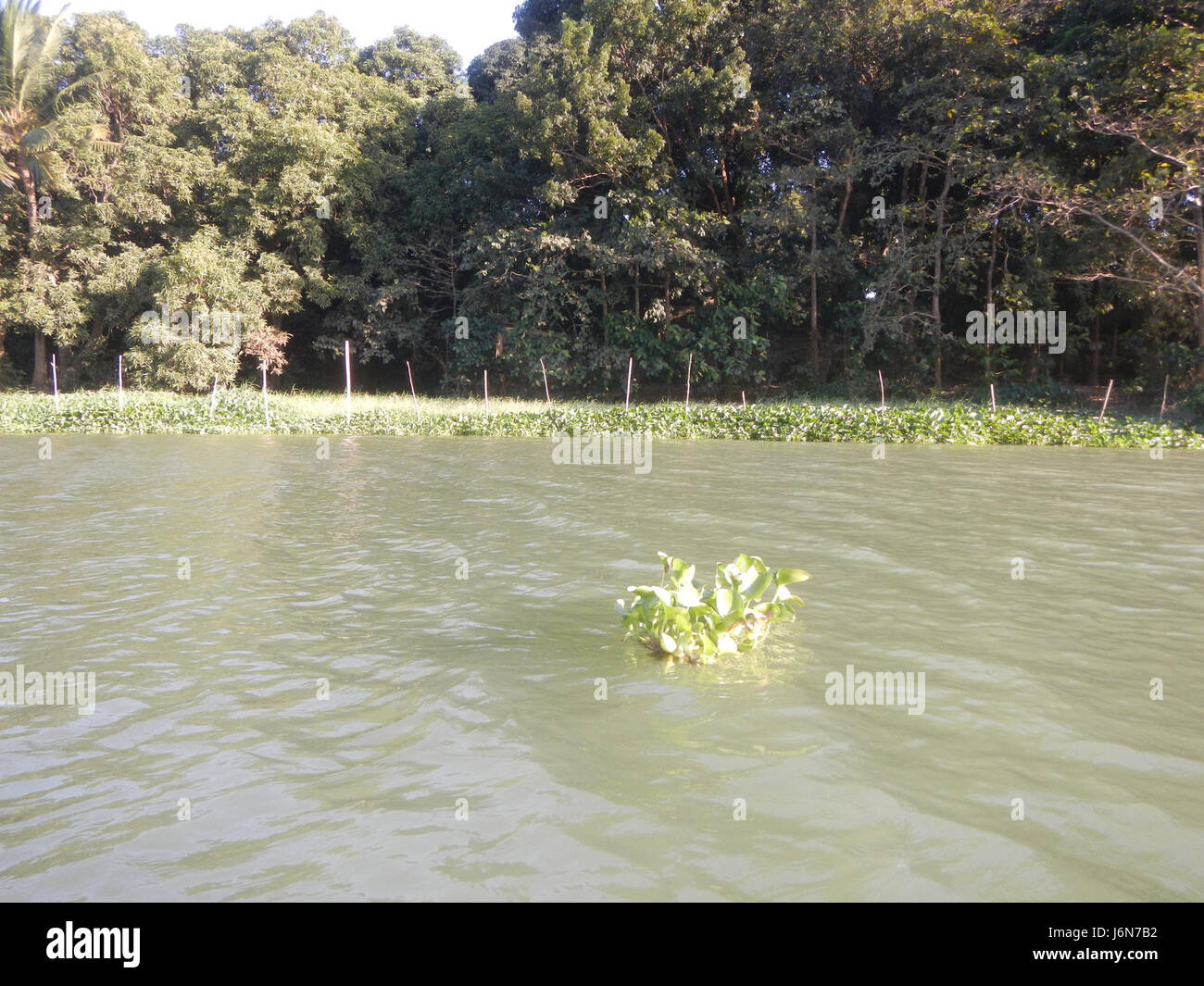 This image depicts the construction of riprap along the riverbanks in ...