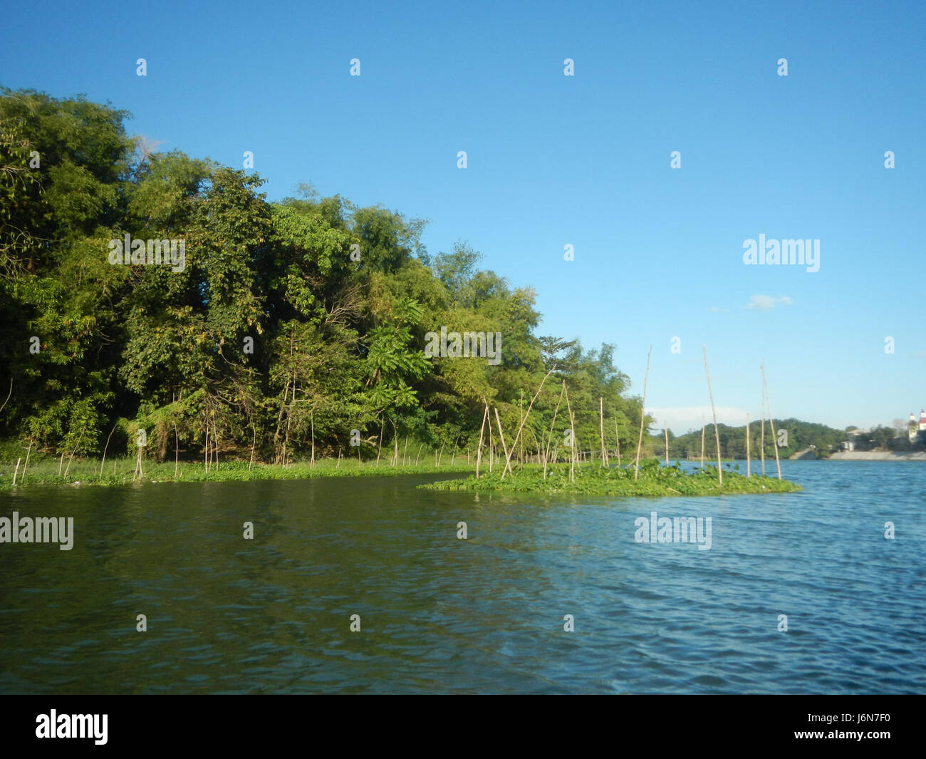 This image shows the construction of riprap along the riverbanks of ...