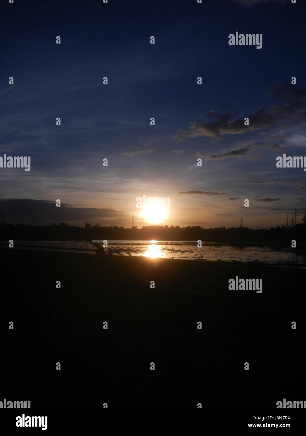 This photograph captures a stunning sunset over San Ildefonso, Bulacan ...