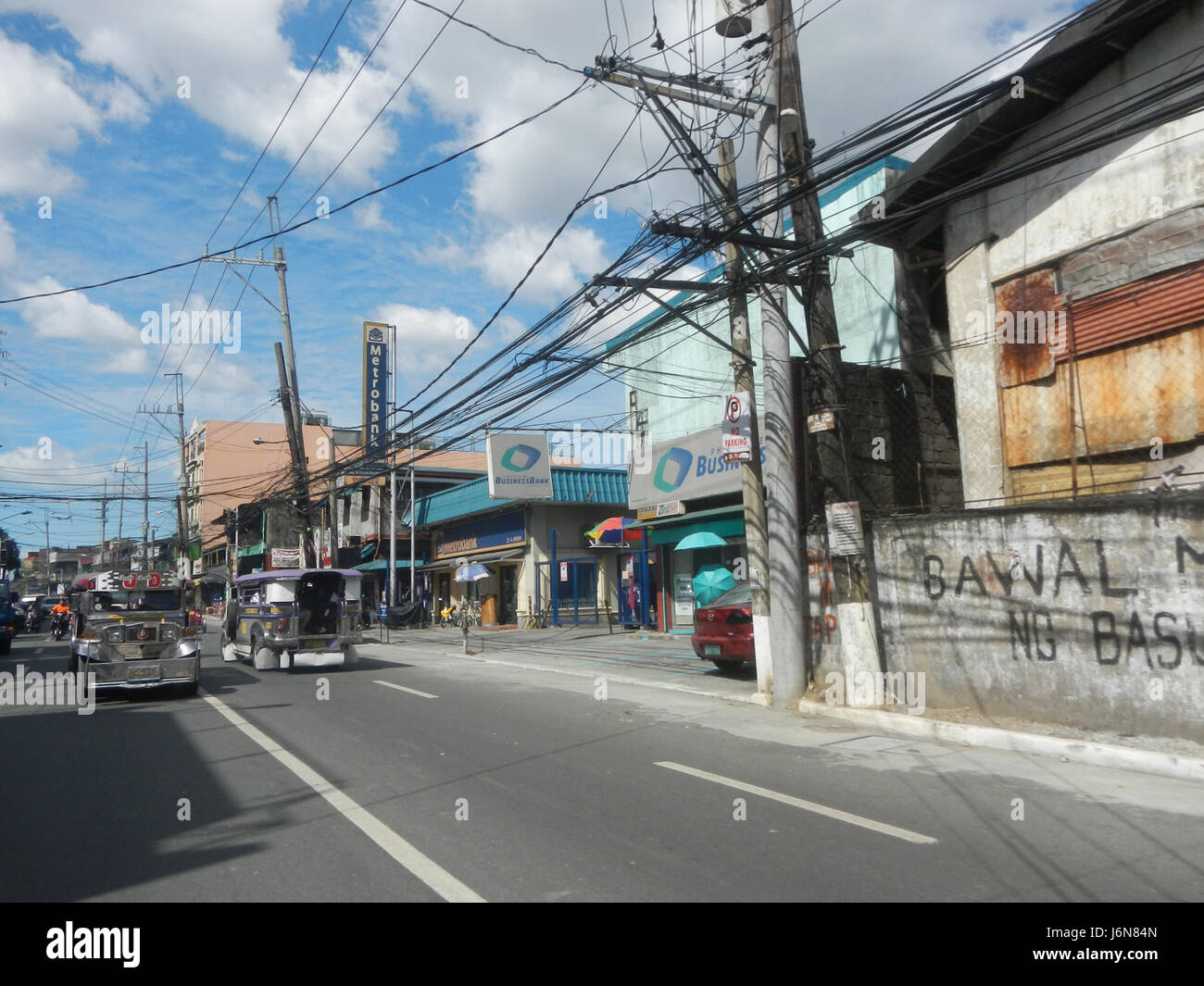 This image depicts a street scene in Caloocan City, highlighting A ...
