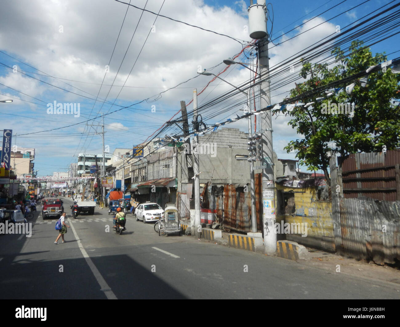 This image captures a view of A. Mabini Street in Caloocan City ...