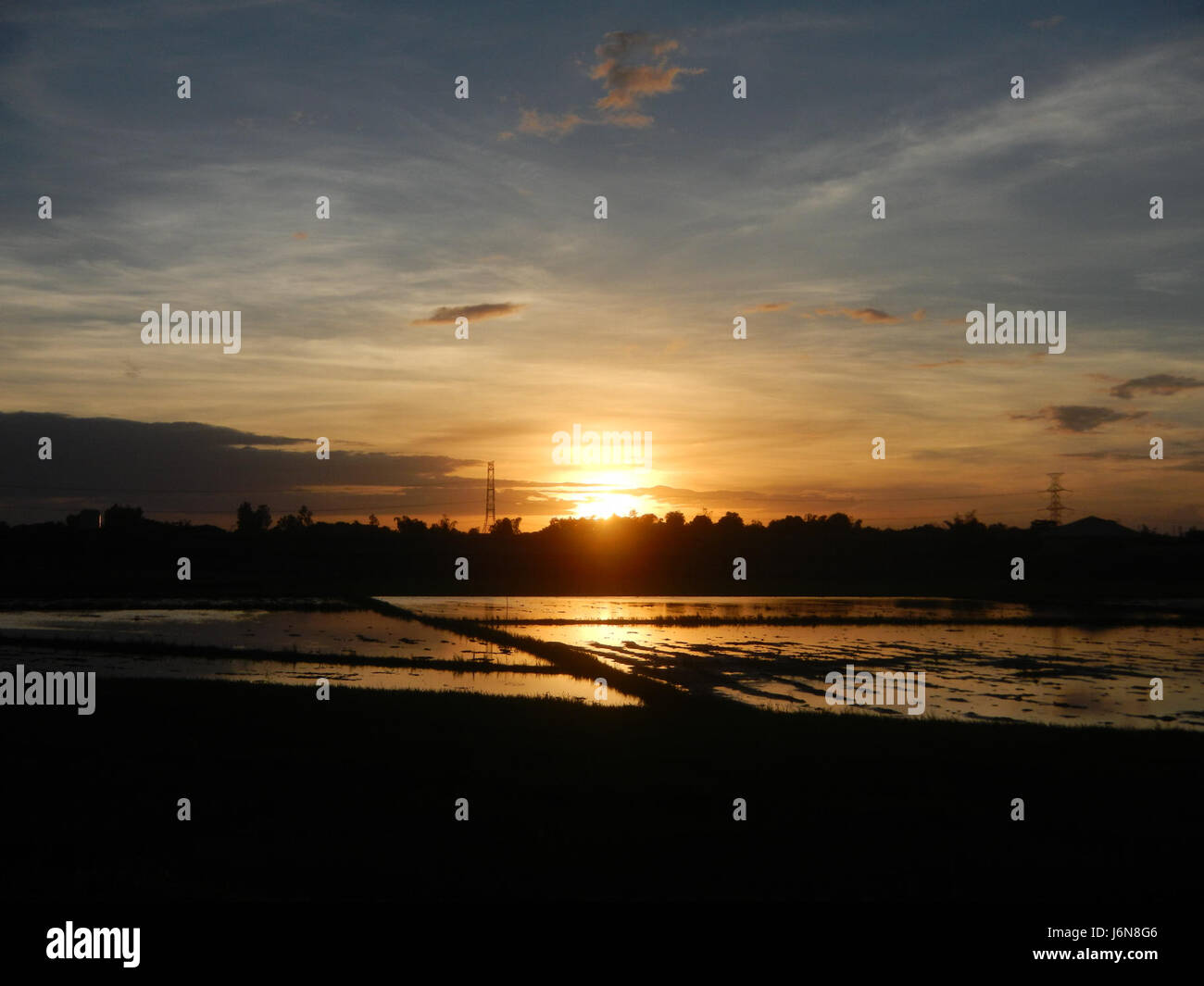 *Sunsets in San Ildefonso Bulacan 0618* depicts the vibrant and ...