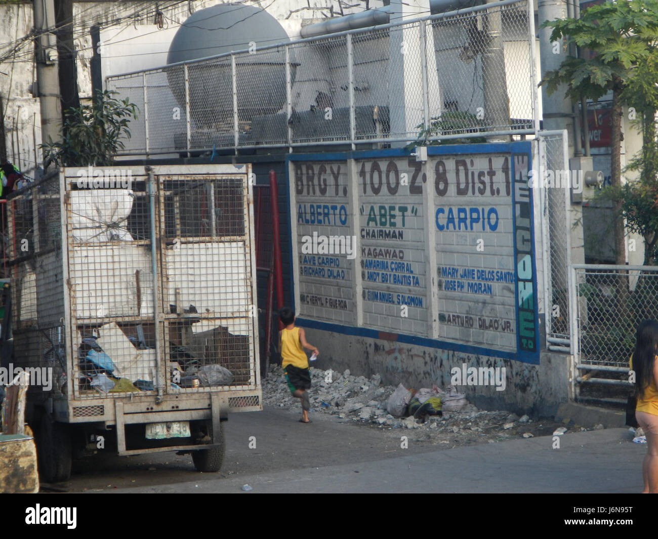 This image depicts Barangay Pier 18 in the Tondo district of Manila ...
