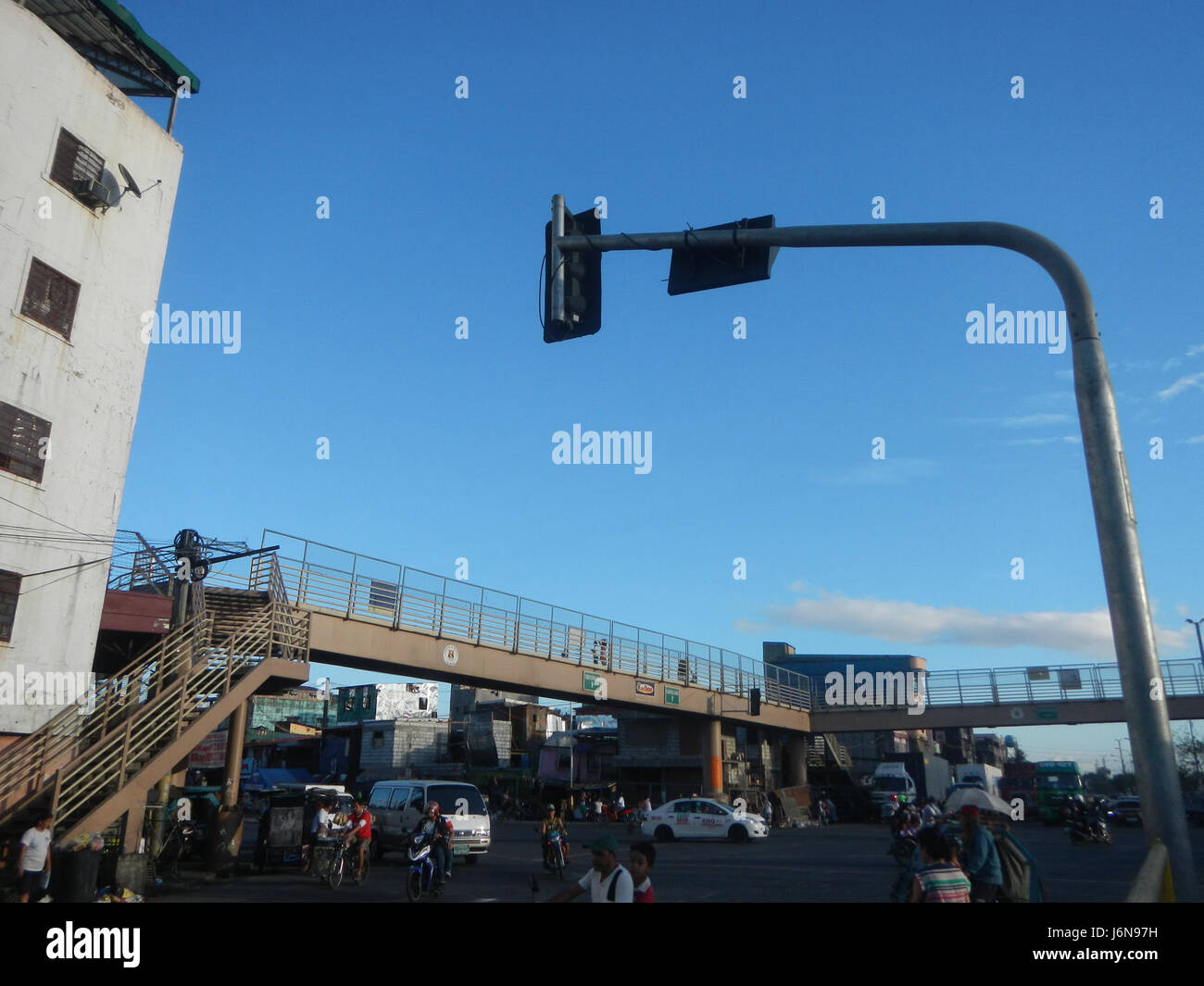 This image features a pedestrian footbridge on Pier 18 in Tondo, Manila ...