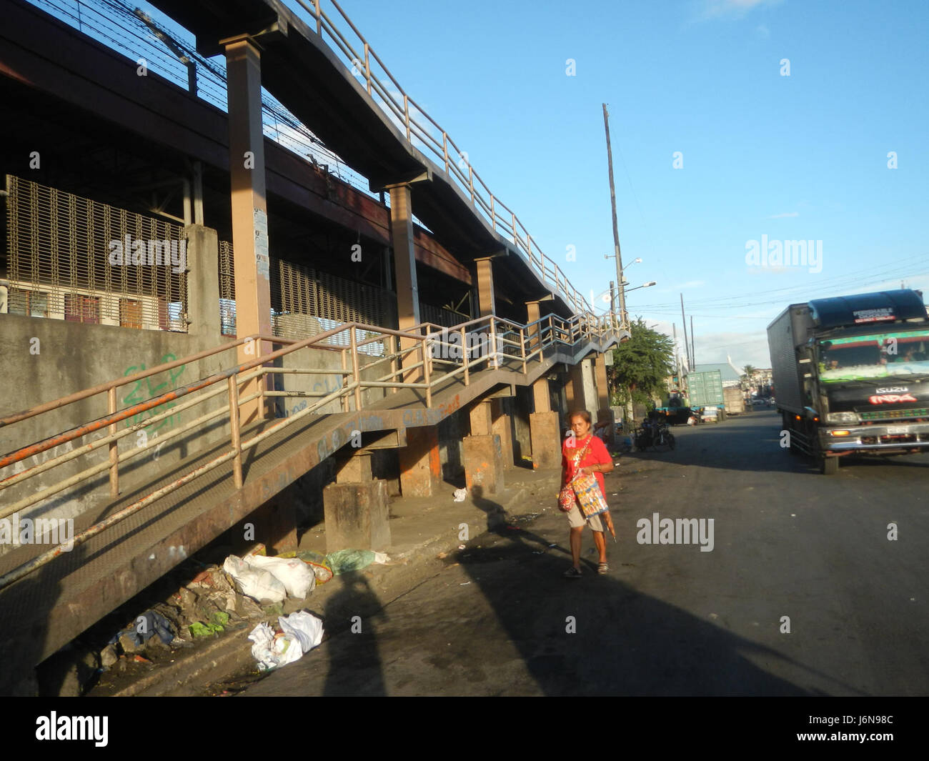 This image depicts the pedestrian footbridge on Capulong Marcos Road in ...