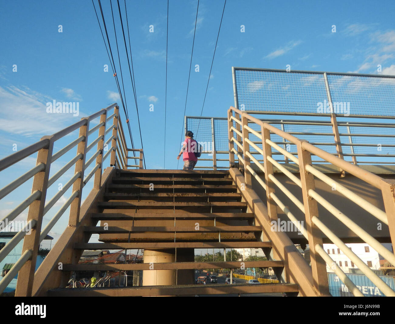 This pedestrian footbridge connects areas along Capulong Marcos Road ...