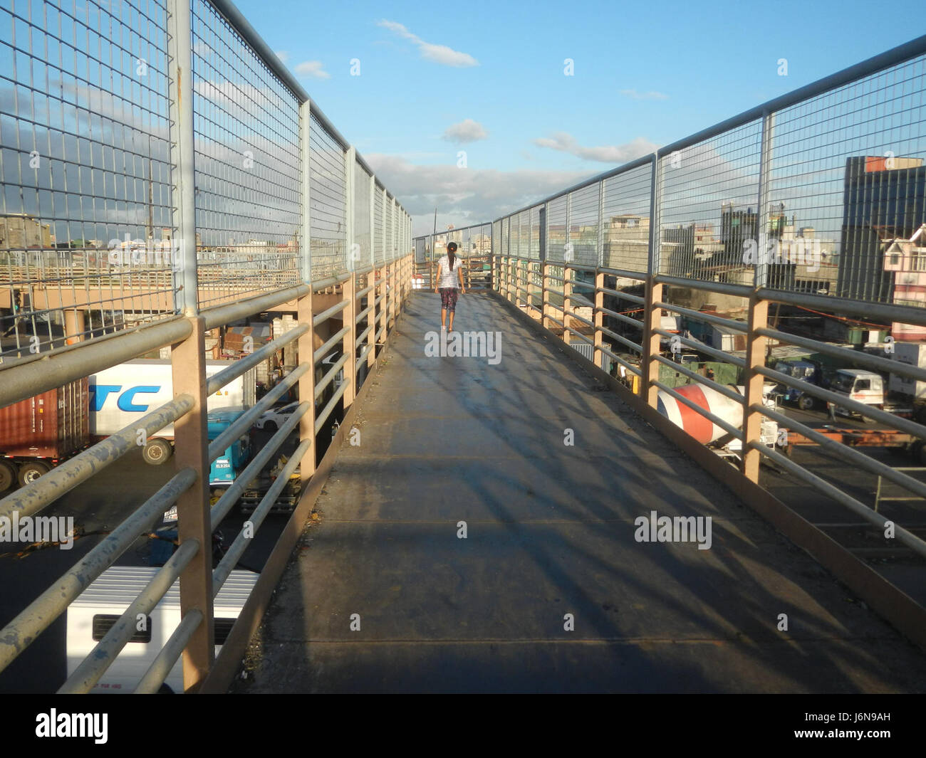 This image shows a pedestrian footbridge located at the intersection of ...