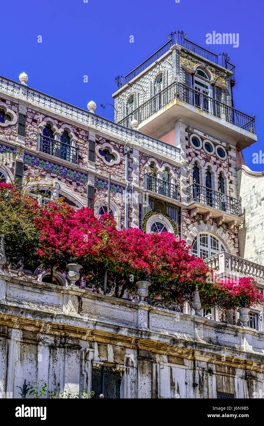 Cute historic building with flowers on the second floor Stock Photo - Alamy