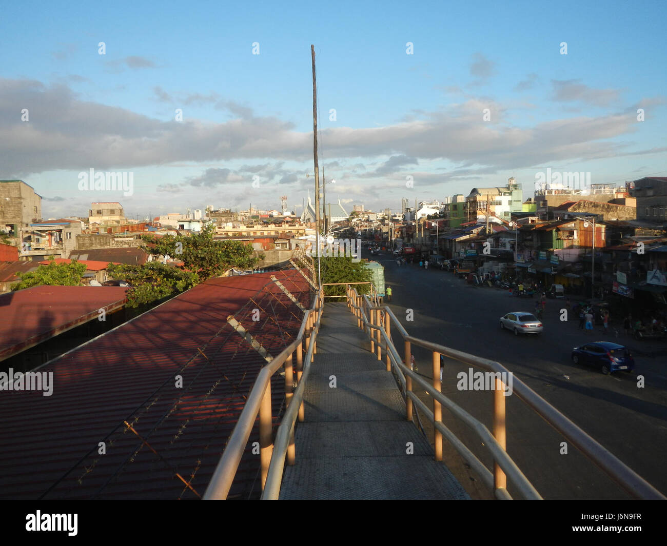 The pedestrian footbridge C-2 connects areas along Capulong Marcos Road ...