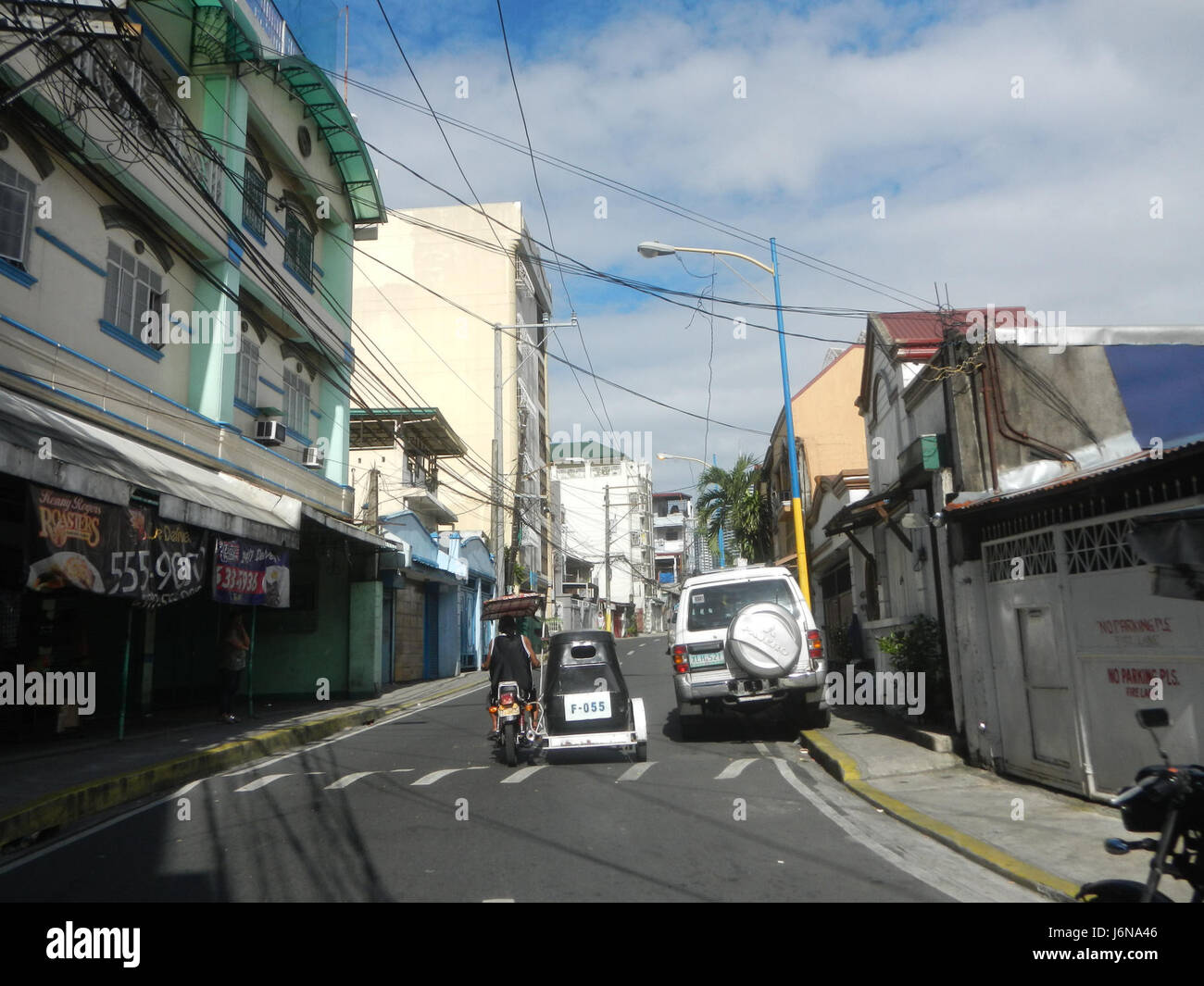 A map or reference to key streets and barangays (districts) in ...