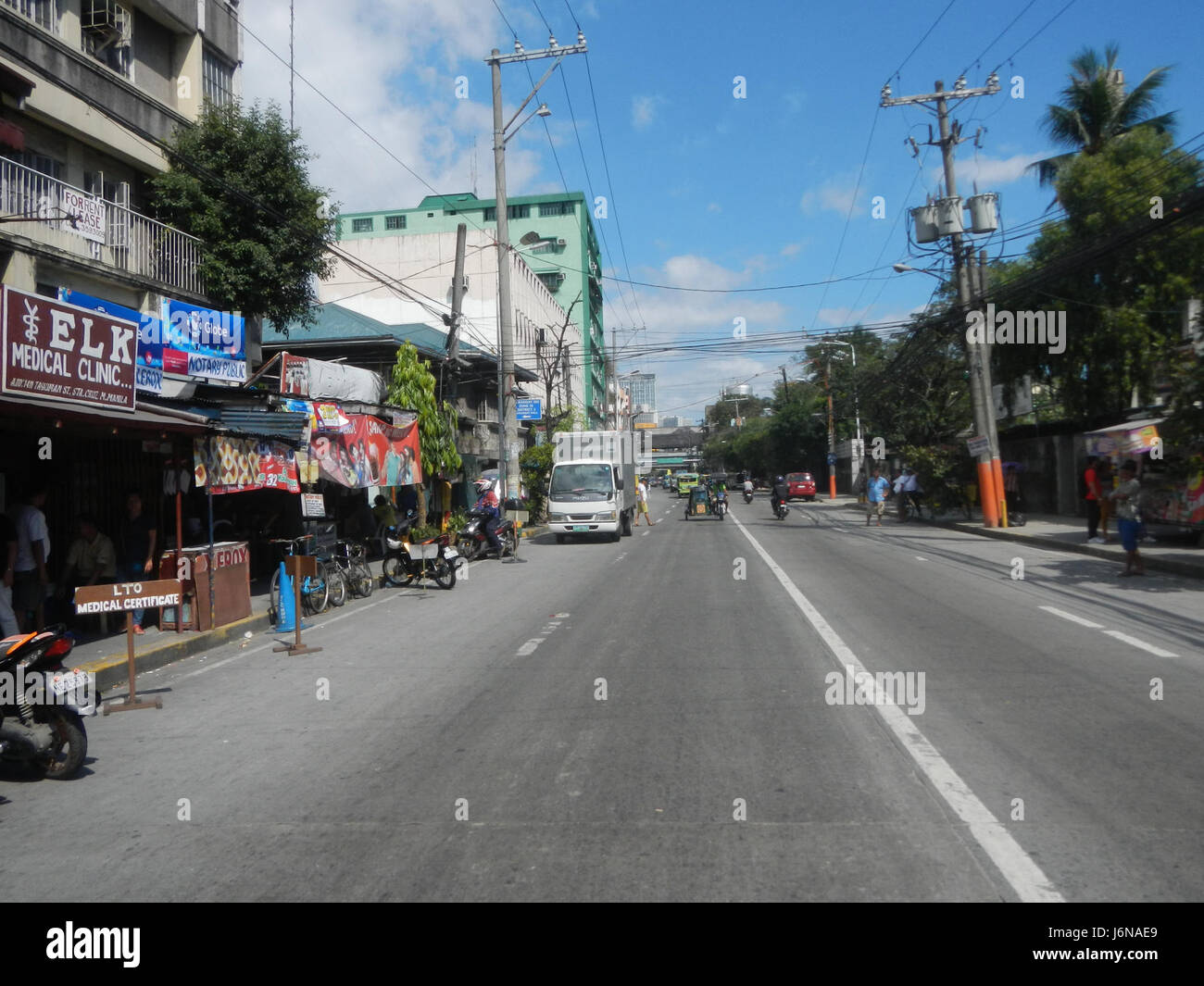 This image shows Tayuman Street in Santa Cruz, Tondo, Manila, with a focus on the urban ...