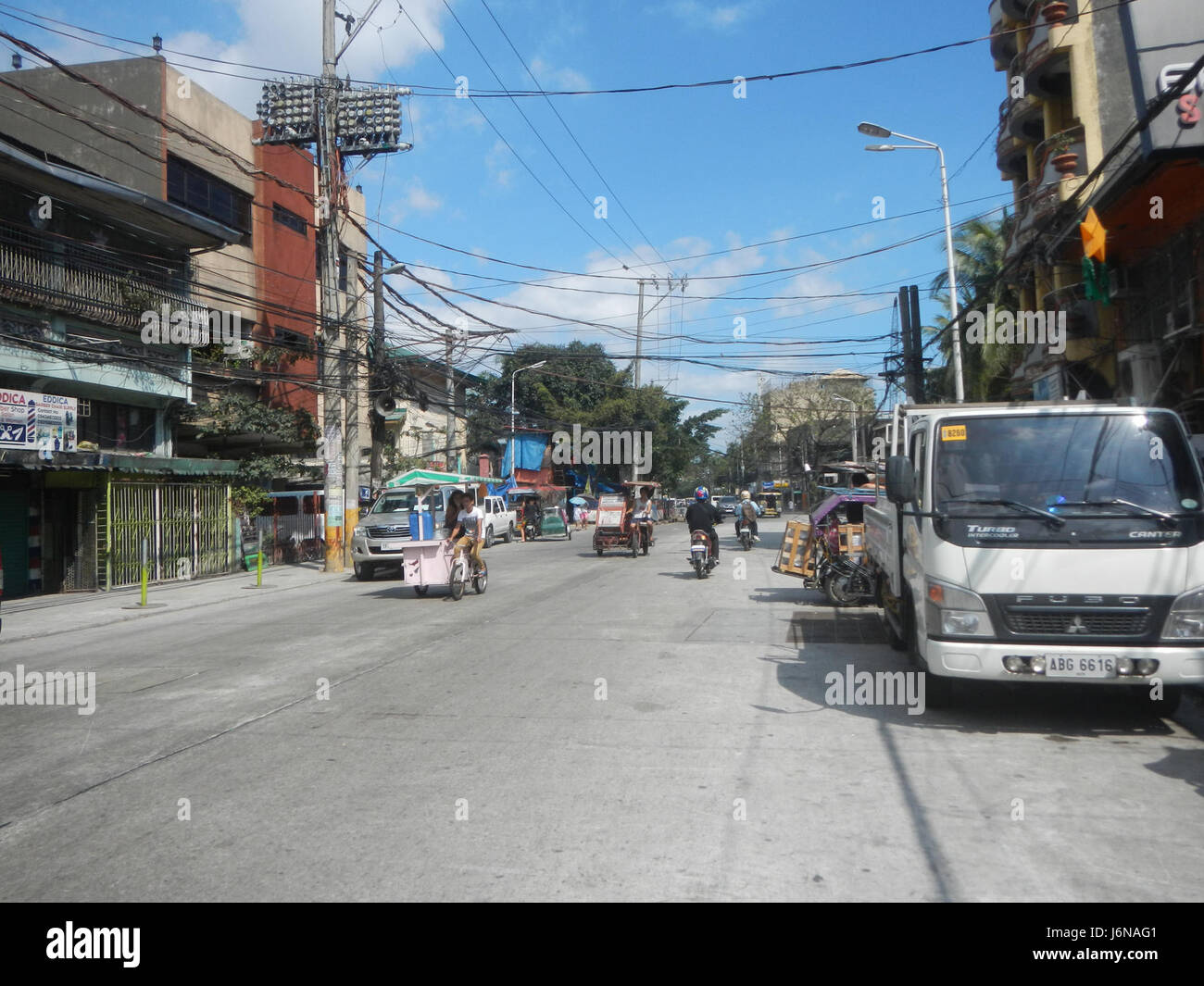 This photograph showcases Tayuman Street in Santa Cruz, Manila, capturing the vibrant street ...
