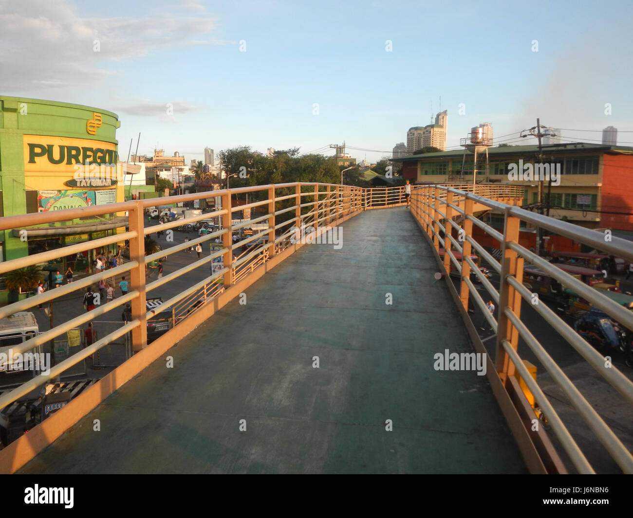 This pedestrian footbridge in Manila connects key locations such as ...