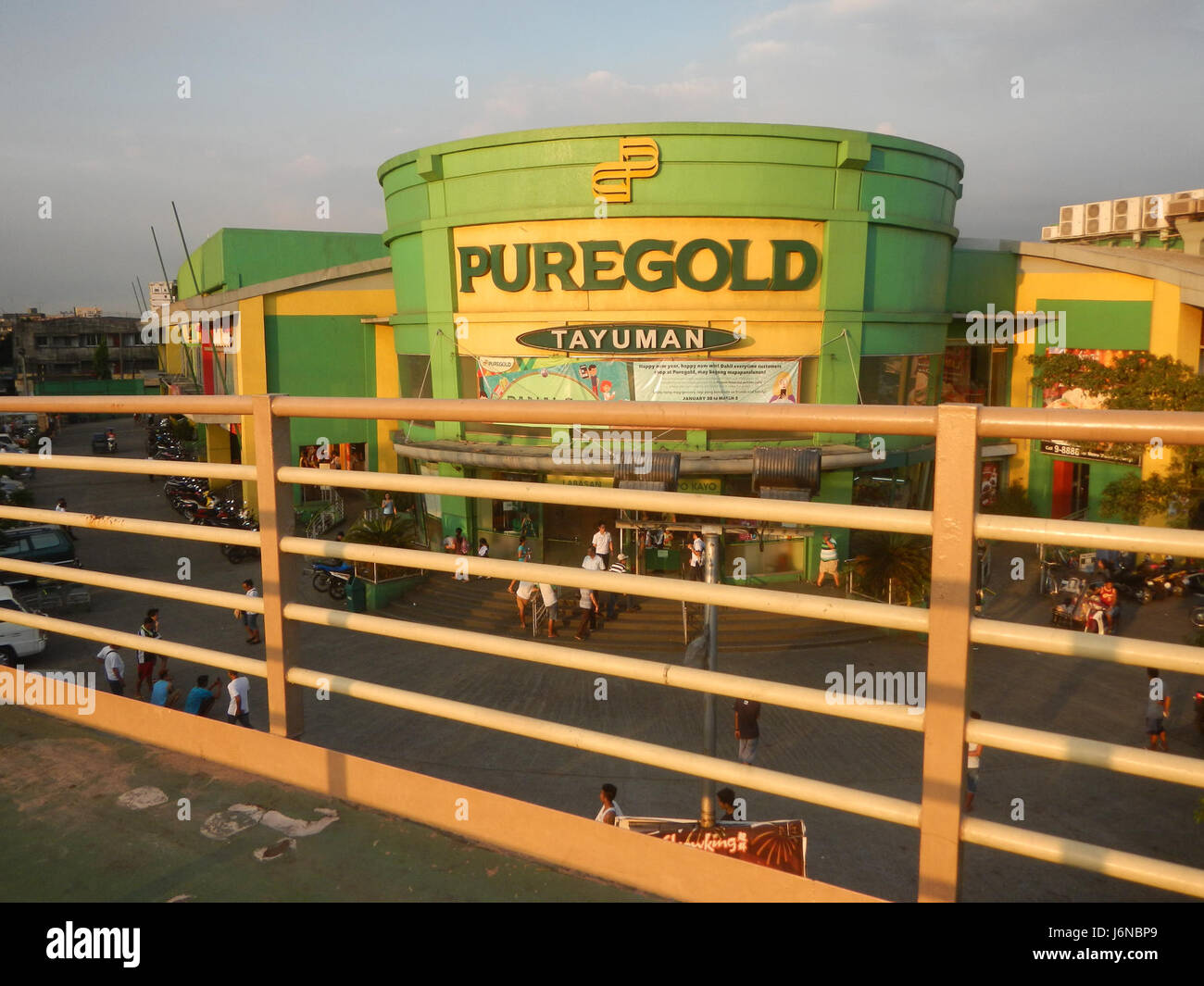 The image shows the pedestrian footbridge at Puregold Tayuman, located ...