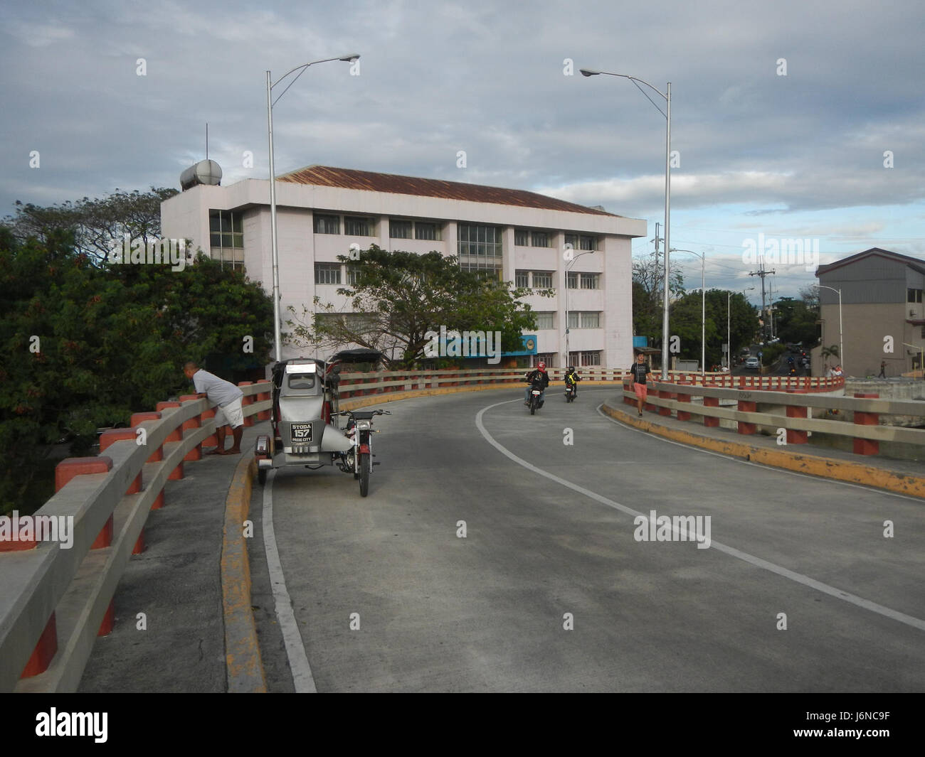 The image shows flood control efforts along the Pasig River near ...