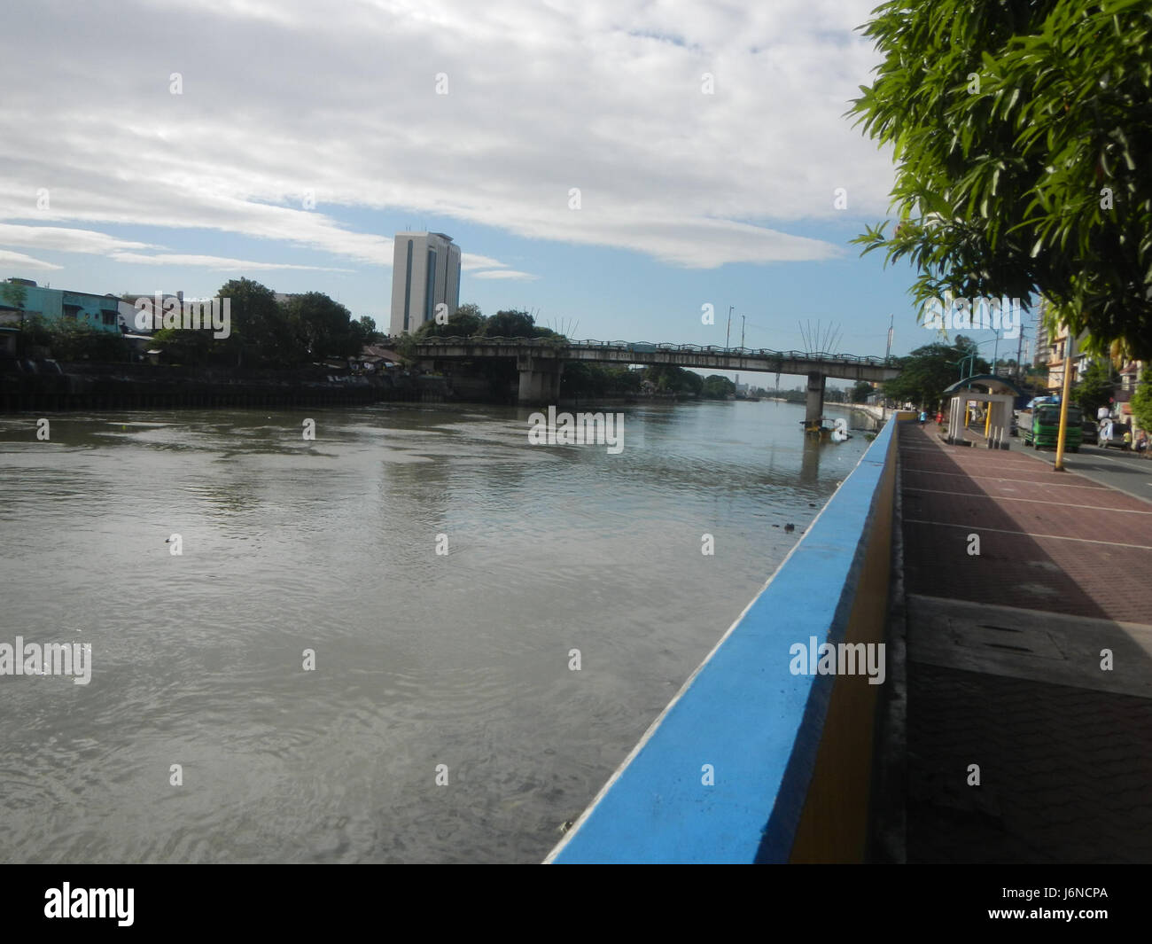 This photograph captures a bustling street scene in Barangay Hulo ...