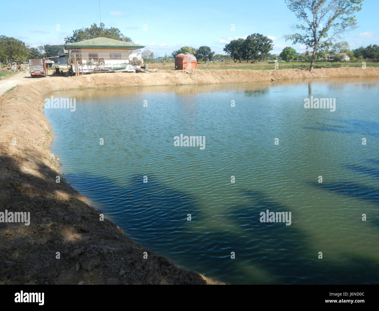 The image depicts fish ponds located in Malamig, Bustos, Bulacan ...
