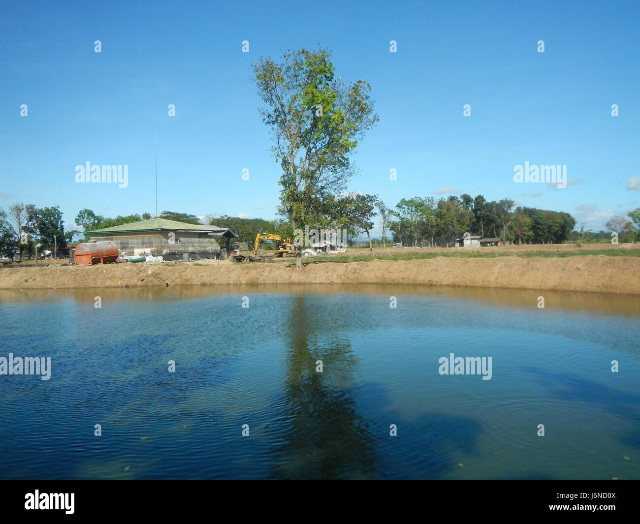 This image shows fish ponds located in Malamig, Bustos, Bulacan. Fish ...