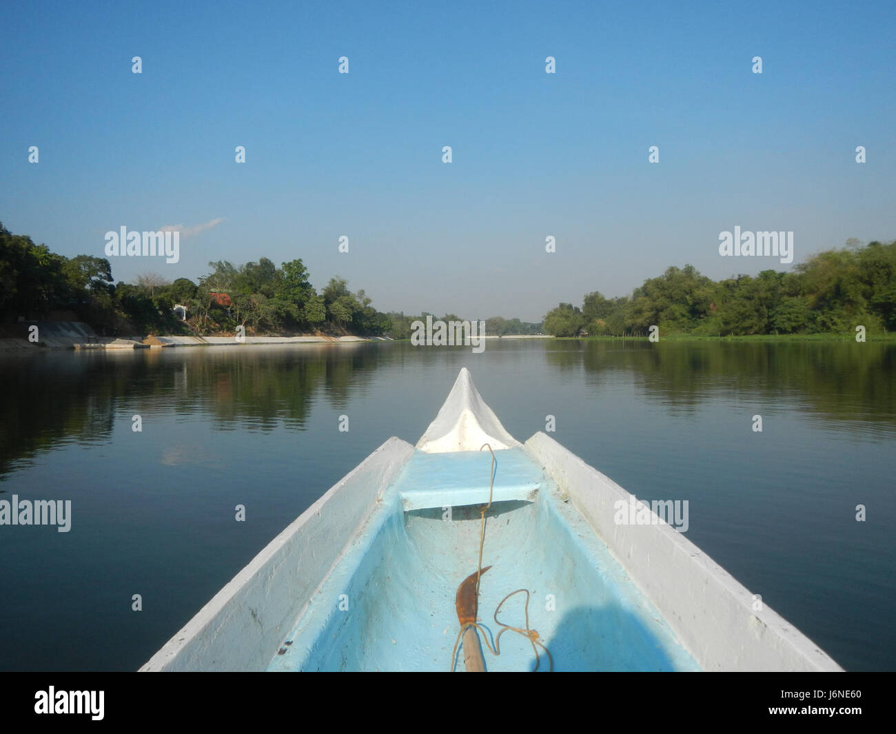 This photograph shows the riverbanks of Pulilan in Bulacan, Philippines ...