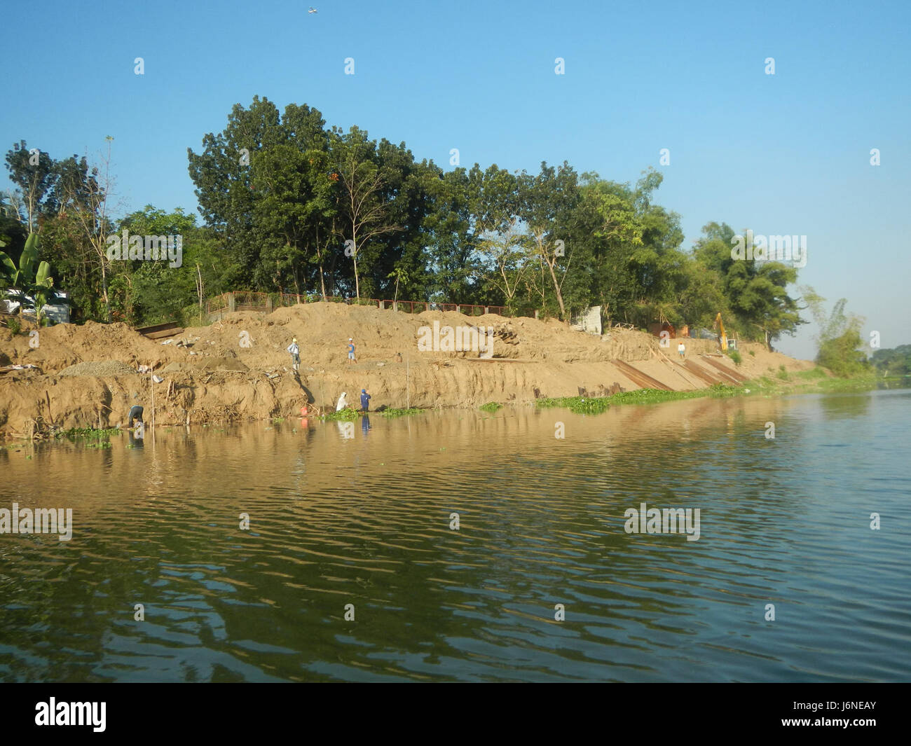This image depicts the riverbanks of Pulilan, Plaridel in Bulacan ...