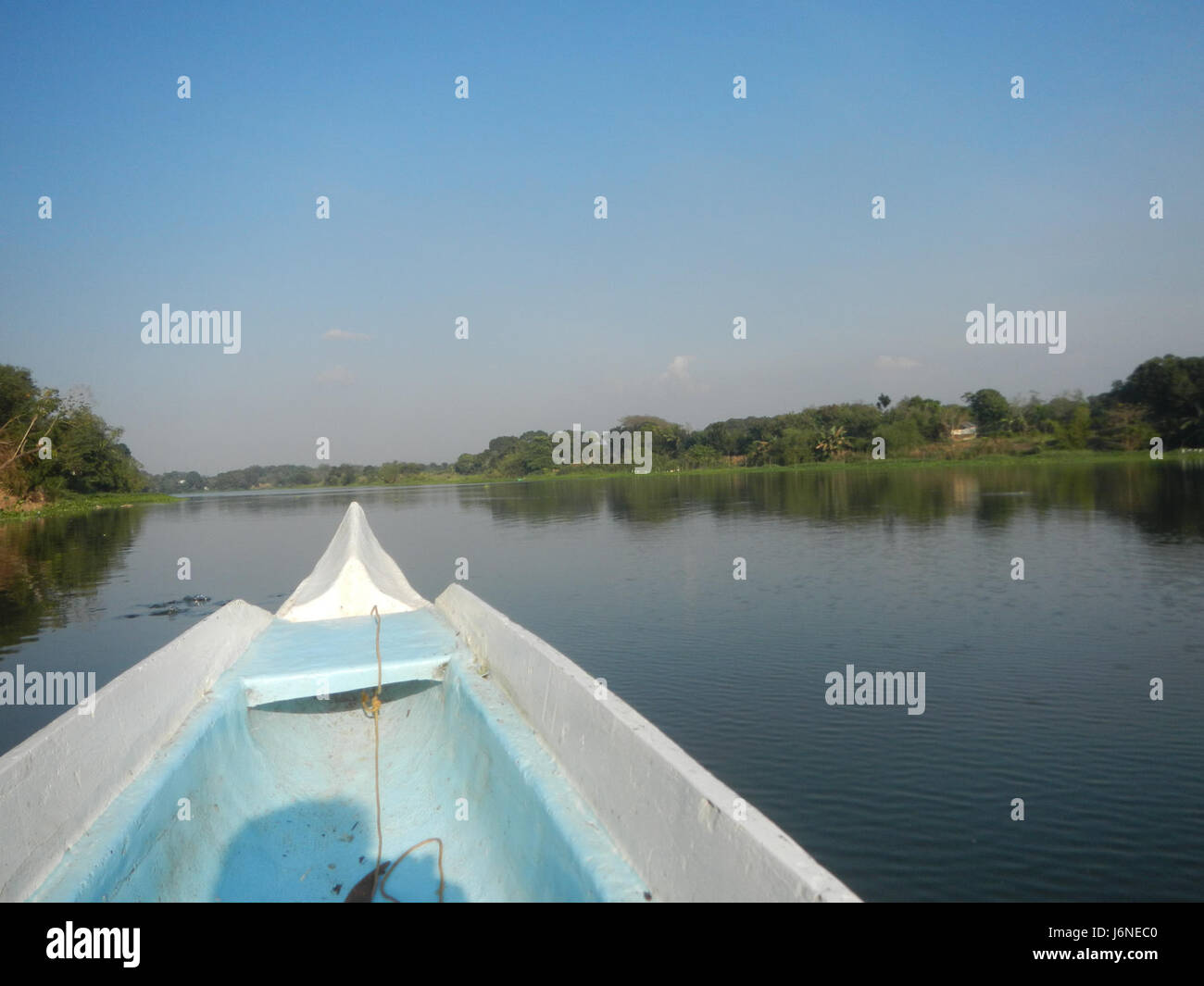 This image captures the riverbanks of Pulilan, showing the agricultural ...