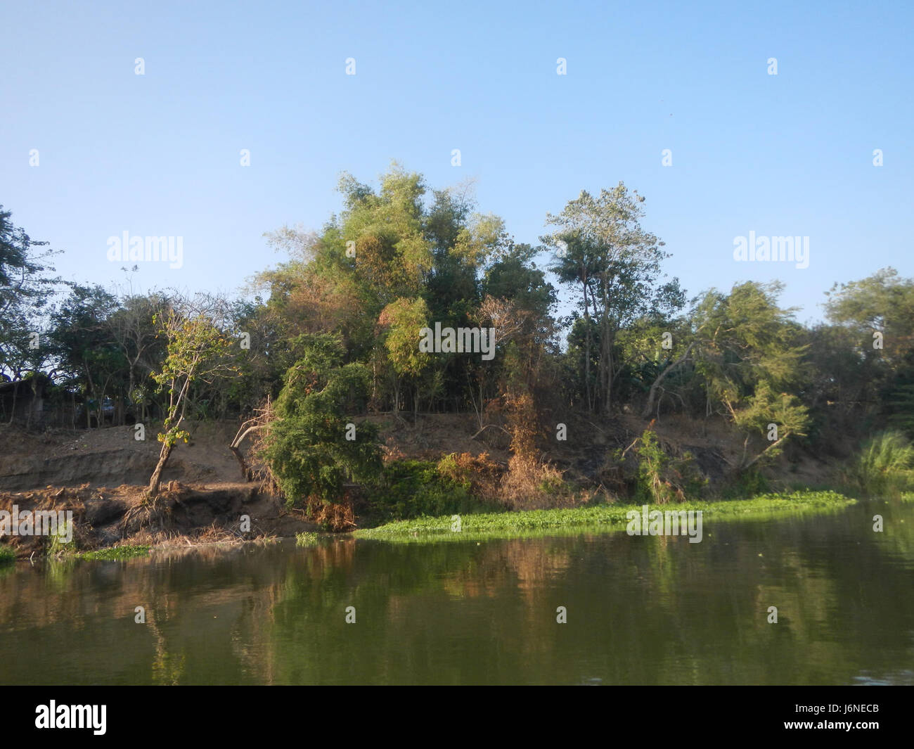 This photograph captures the riverbanks of Pulilan, located in Bulacan ...