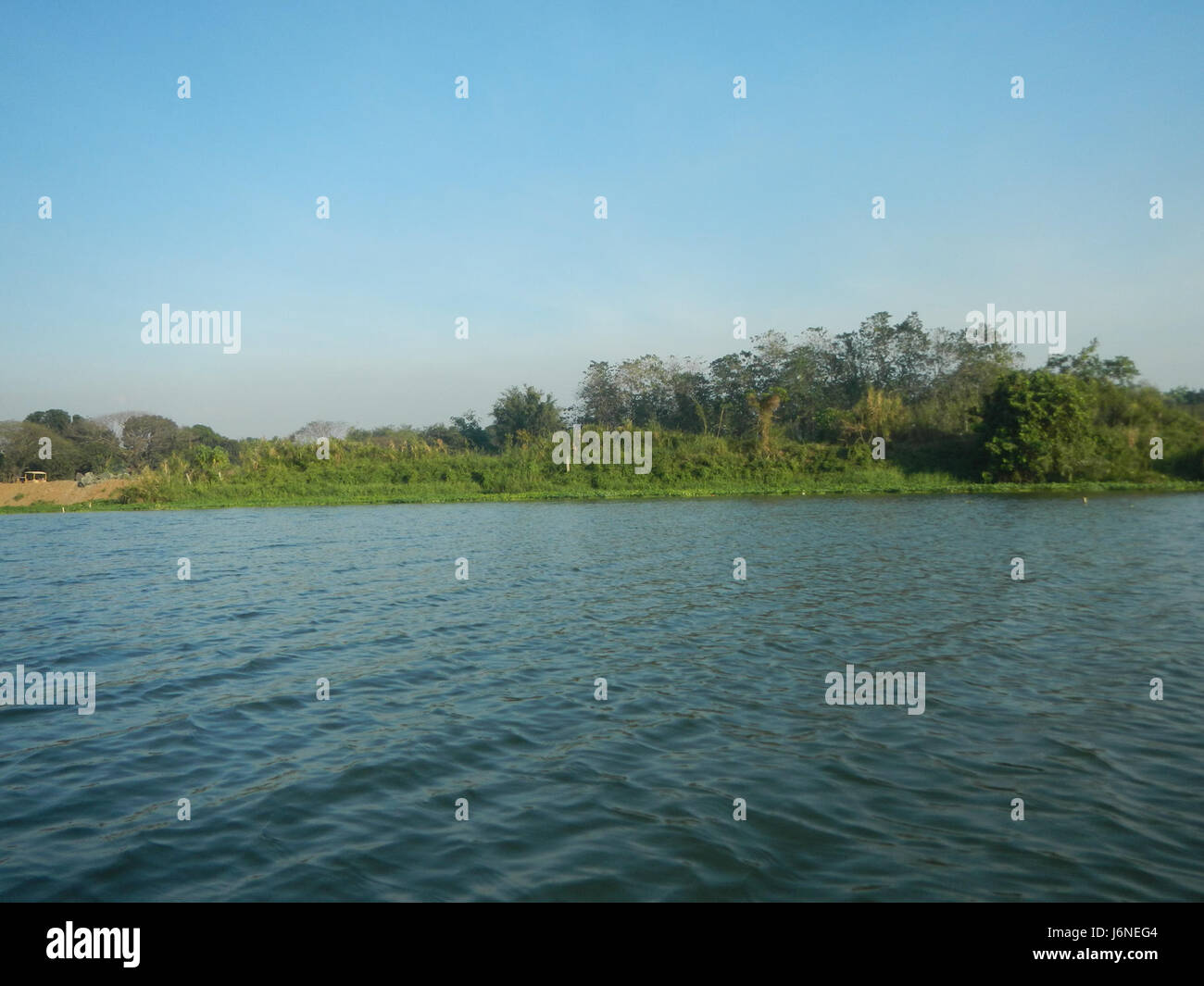 This image captures the riverbanks along the Pulilan River in the ...
