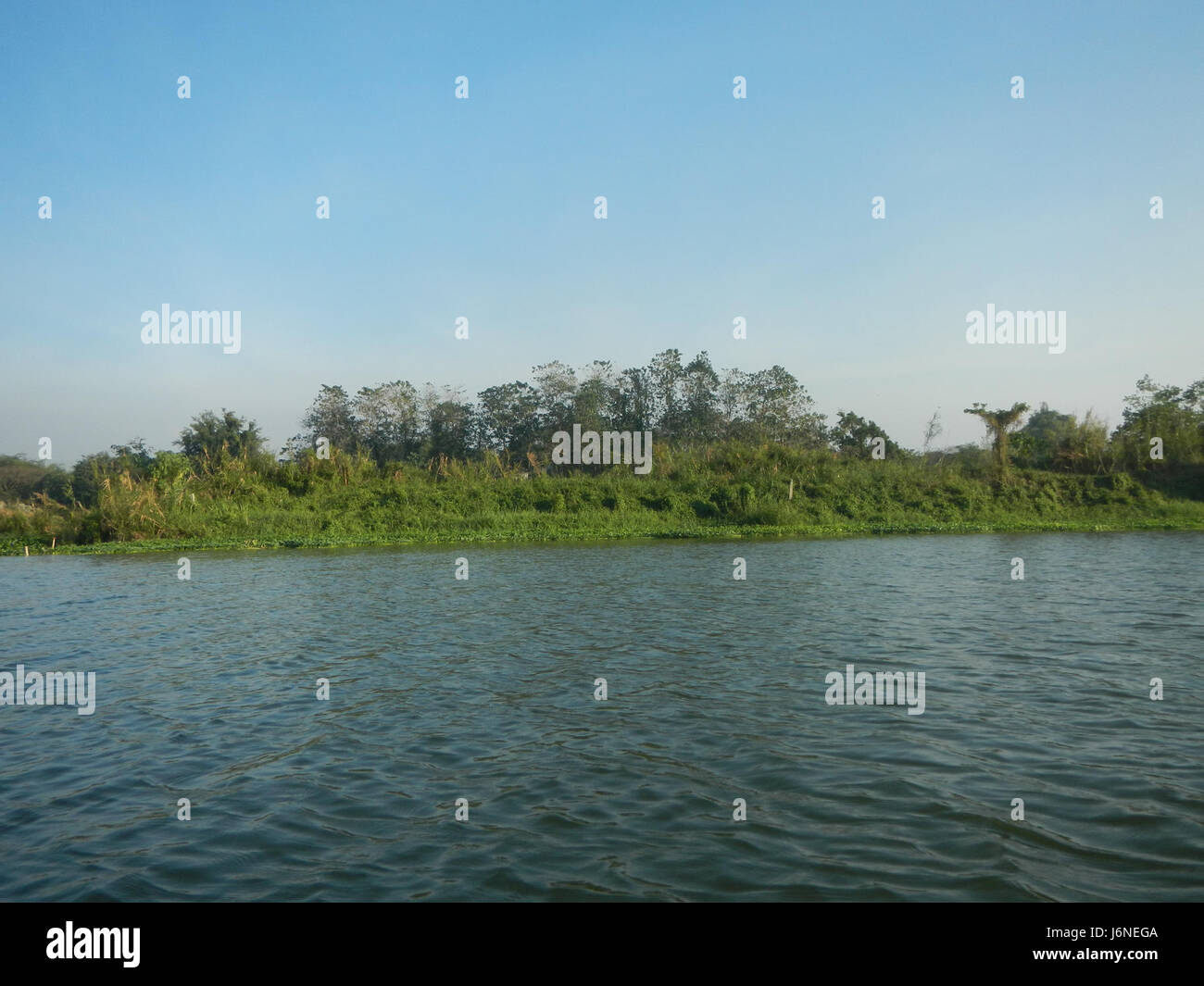 This image captures the riverbanks of the Pulilan River, passing ...