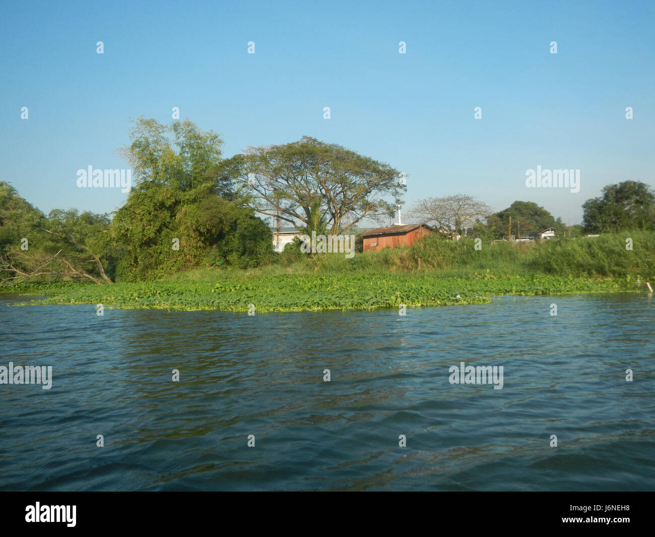 A landscape photo showcasing the riverbanks of Pulilan, with views of ...