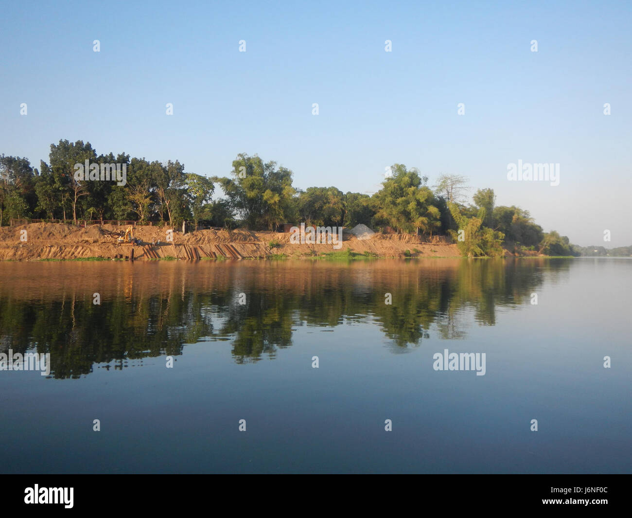 The image shows the riverbanks along the Pulilan River in Plaridel ...
