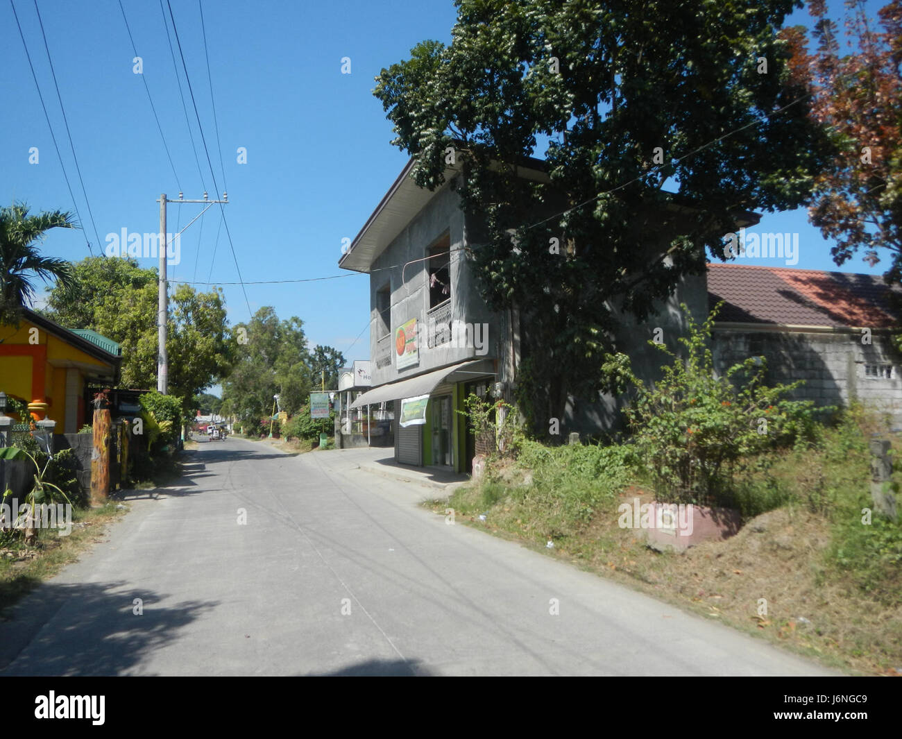 The image features the road construction project in Poblacion San Roque ...