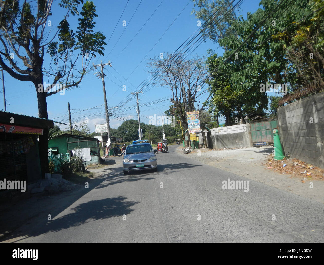 The image shows construction along a road in Pandi, Bulacan ...