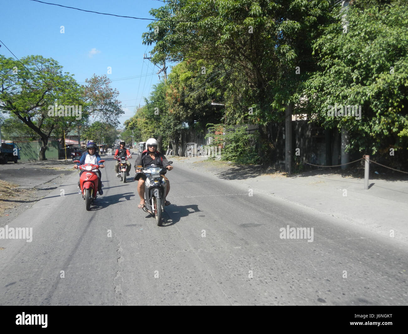 A rural road in Bulacan, Philippines, running through the towns of ...