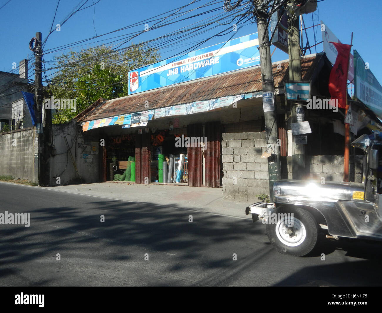 The image shows Fortunato Halili Avenue, a major road connecting San ...